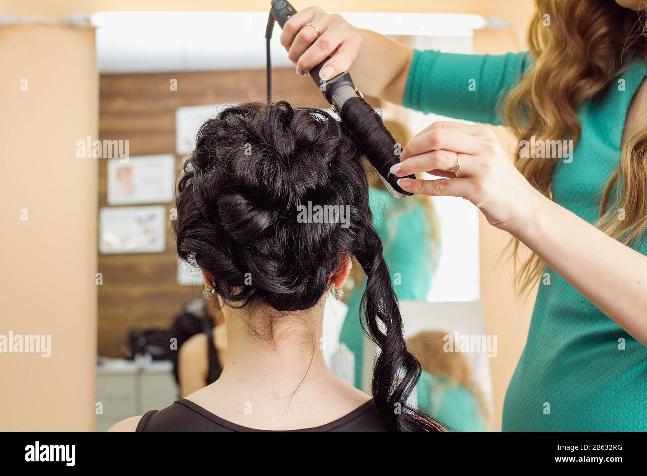 The master hairdresser doing a hairdress in a barber salon Stock Photo ...