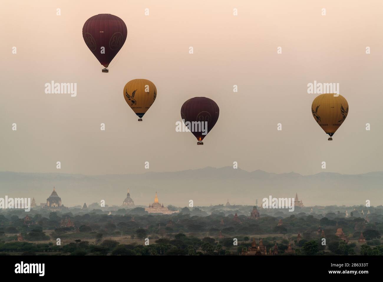 hot air balloons over landscape with Bagan temples, Myanmar, Asia Stock ...
