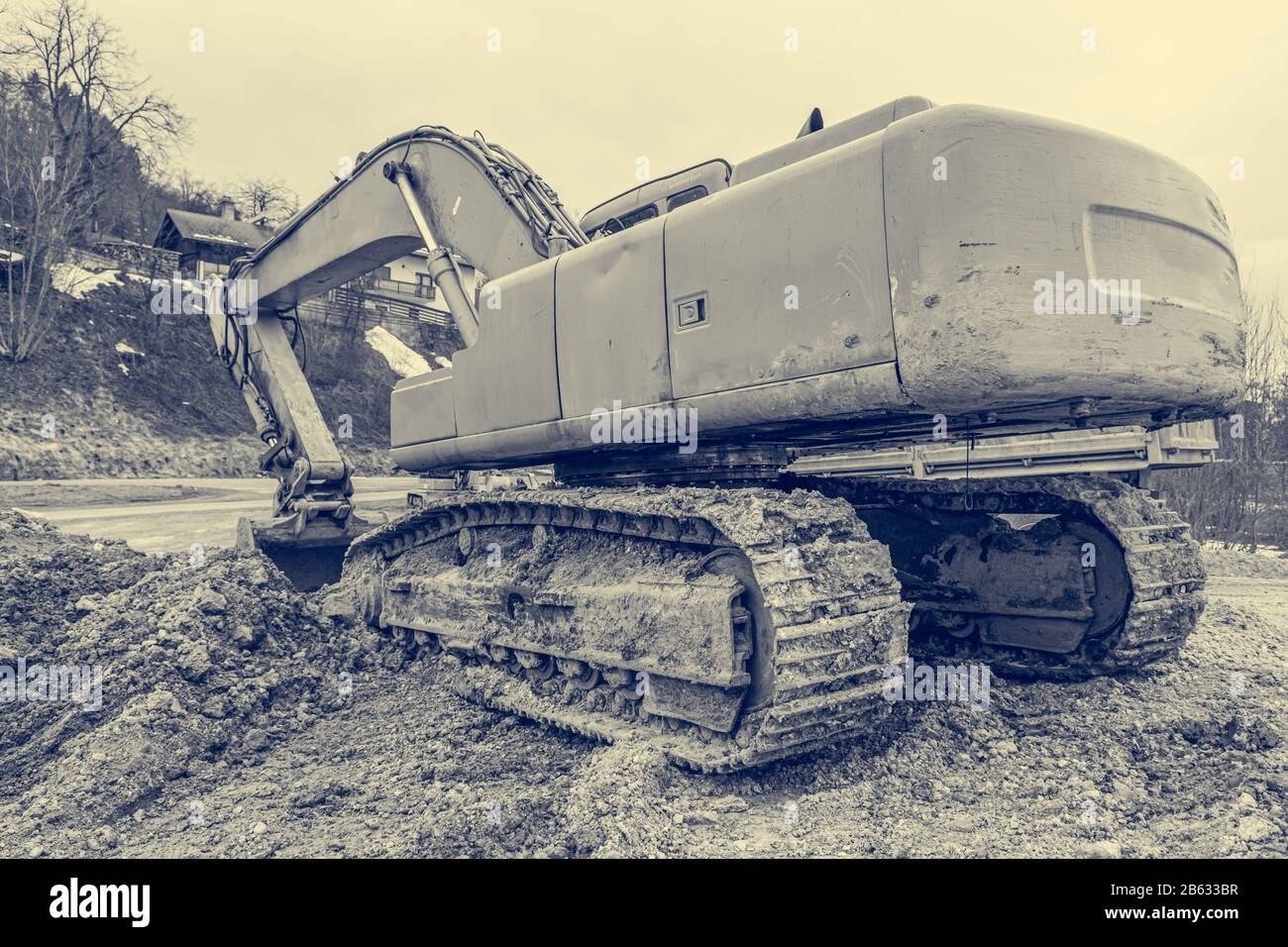 Excavator ready to start digging on a construction site Stock Photo - Alamy