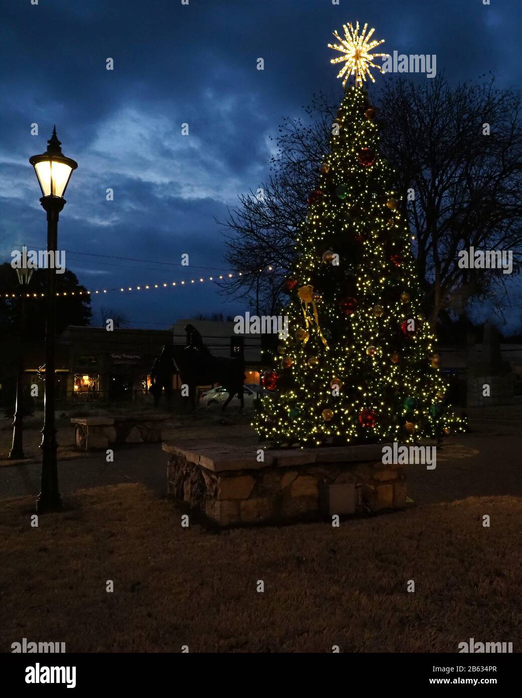 Lighted Christmas tree in town square Stock Photo - Alamy