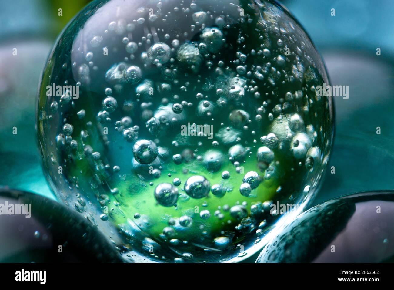 Close up macro shot of marbles. Glass sphere with air bubbles ...