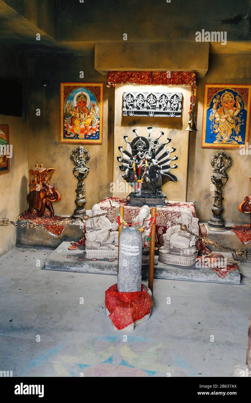 Religious room with a Buddha and Ganesha statue Stock Photo - Alamy