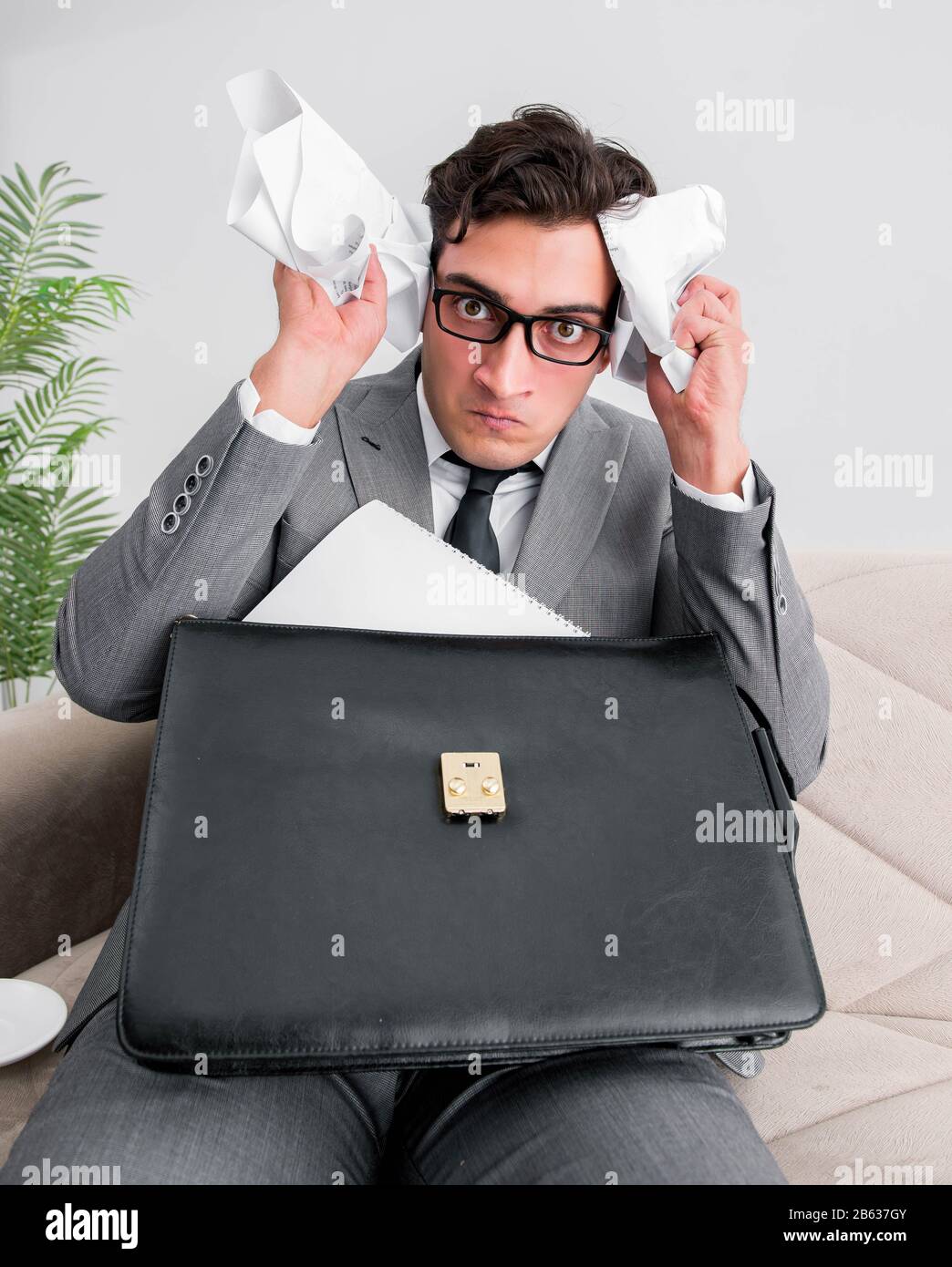 The angry businessman with crumbled paper Stock Photo - Alamy