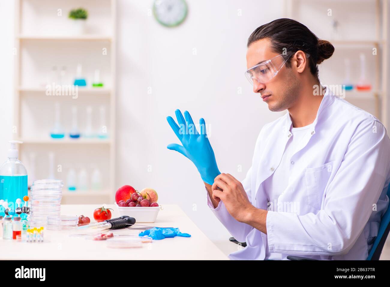 Young nutrition expert testing food products in lab Stock Photo - Alamy