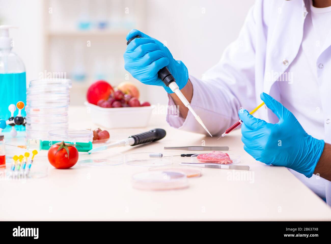 Young nutrition expert testing food products in lab Stock Photo - Alamy