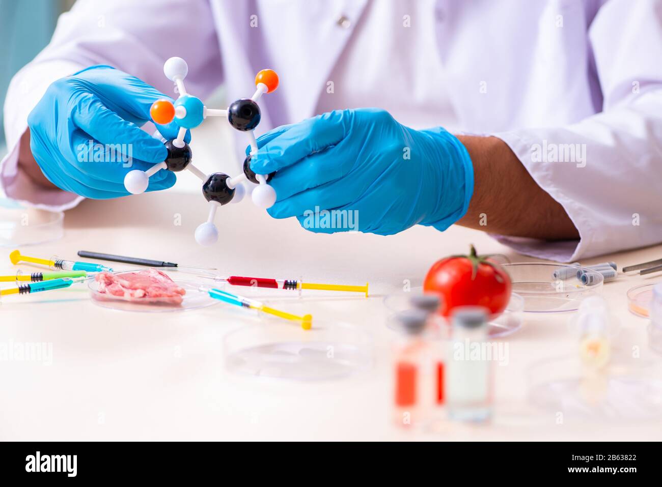 Young nutrition expert testing food products in lab Stock Photo - Alamy