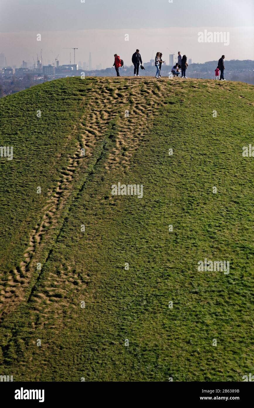 Walkers on the mounds of Northala Park, Northolt, London Stock Photo ...