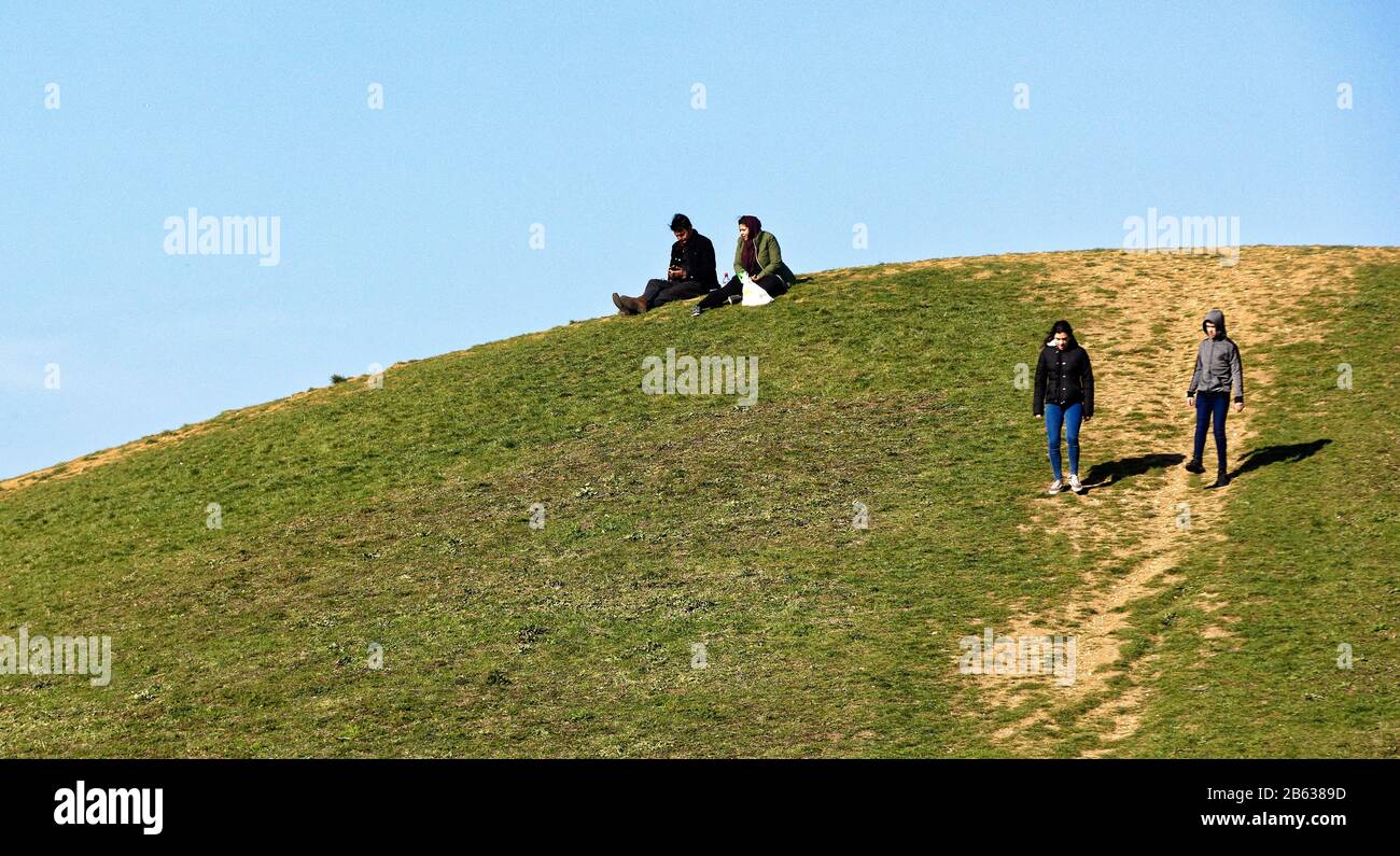 Walkers on the mounds of Northala Park, Northolt, London Stock Photo ...