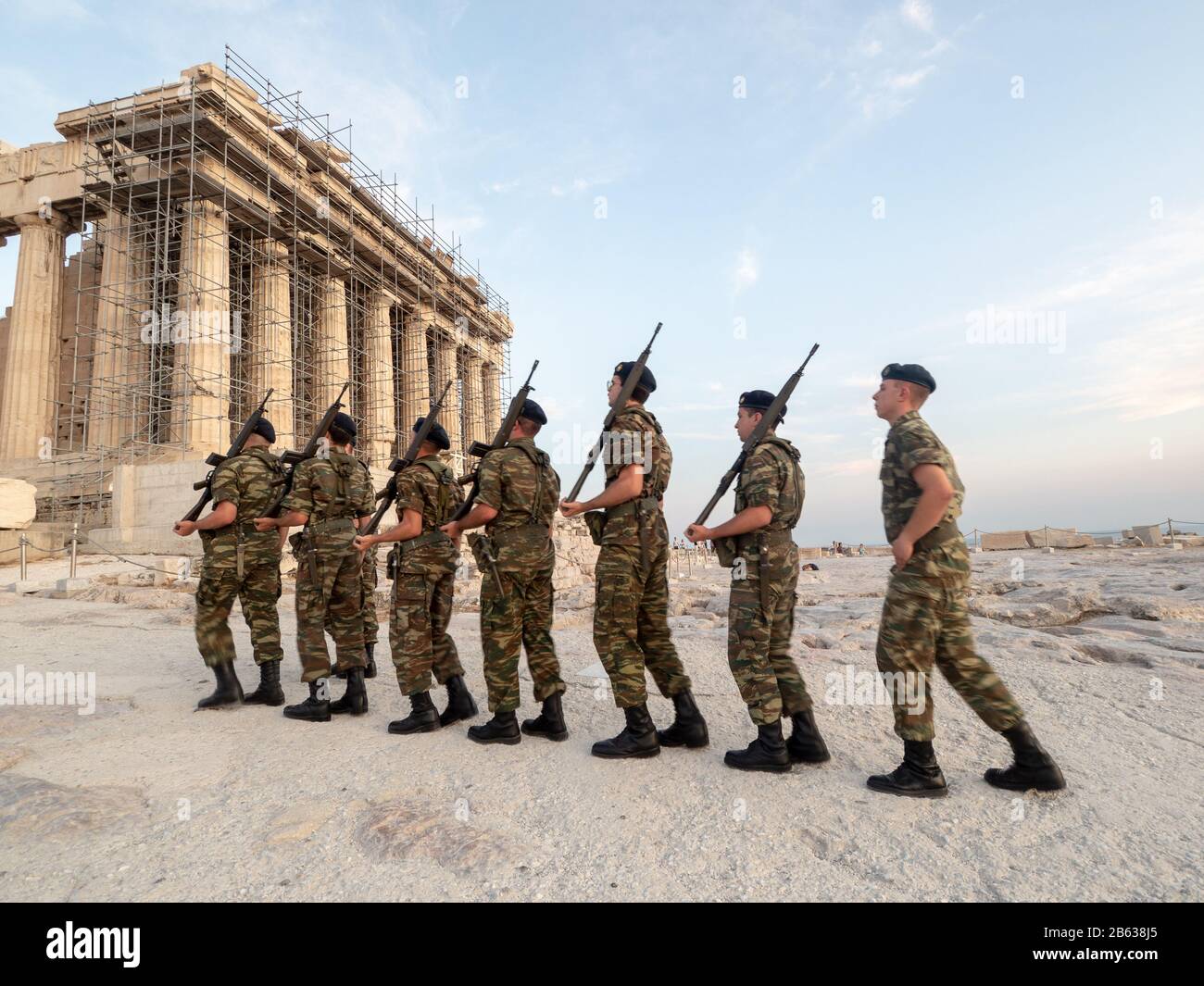 Military units walk over acient monument of Parthenon, Athenian ...