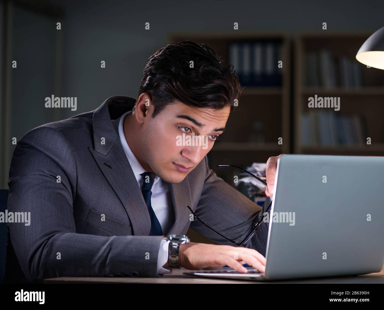 The man staying in the office for long hours Stock Photo - Alamy