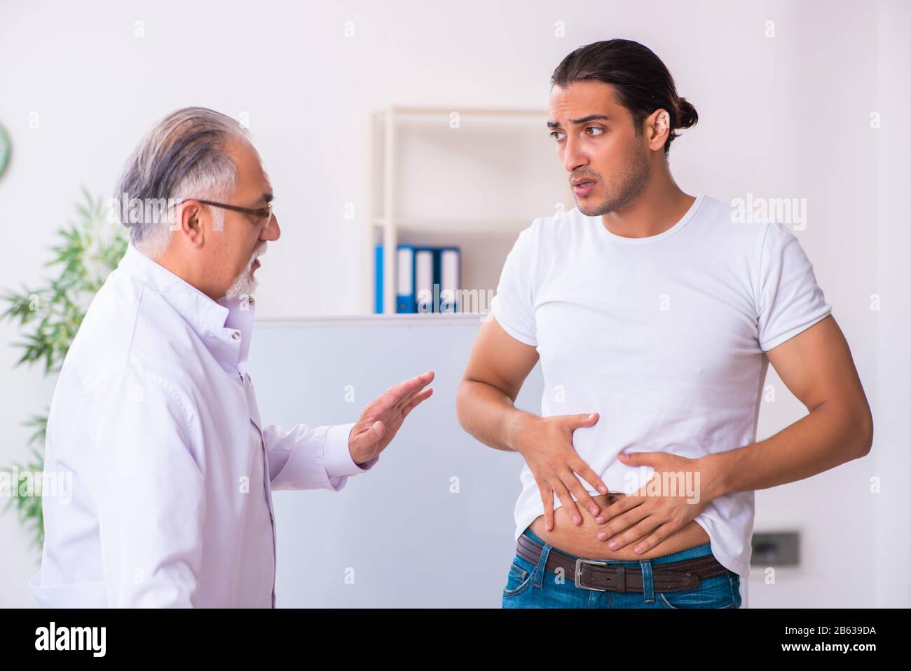 The doctor dietician giving advices to fat overweight patient Stock ...