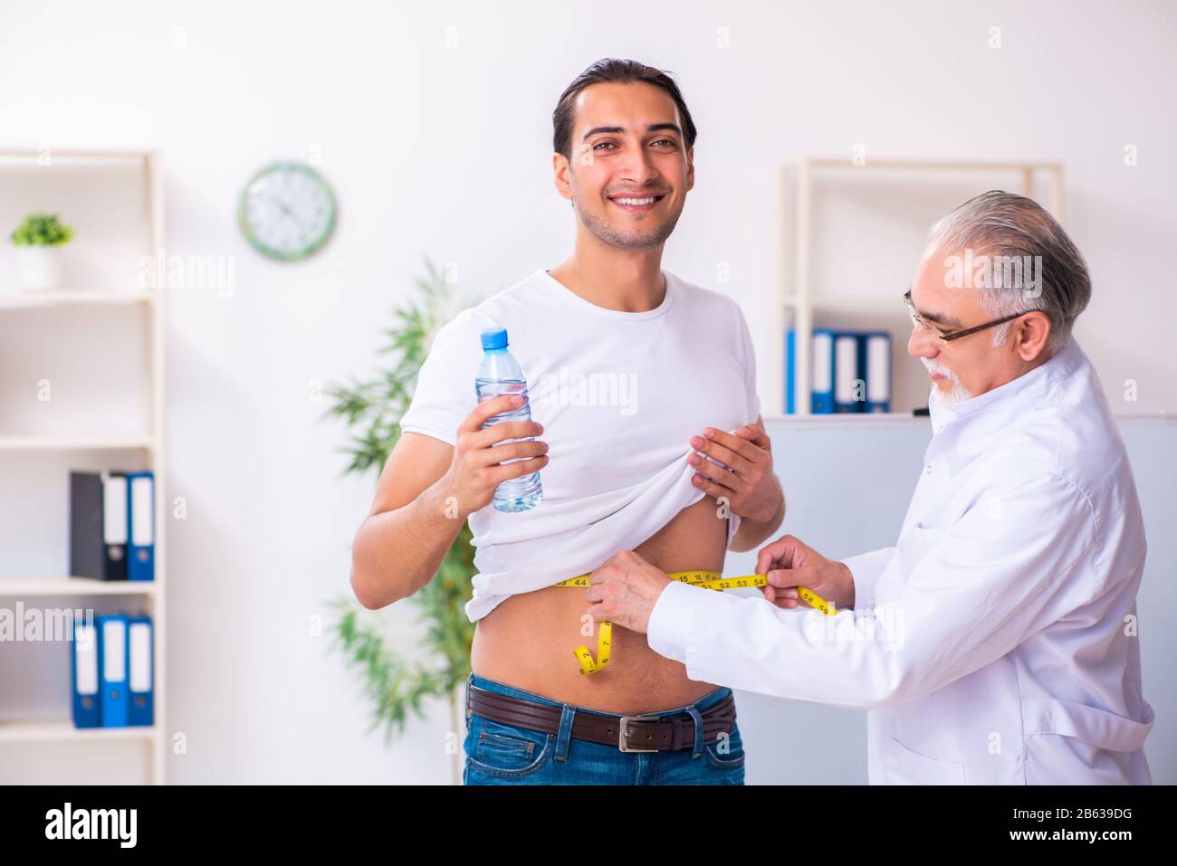 The doctor dietician giving advices to fat overweight patient Stock ...