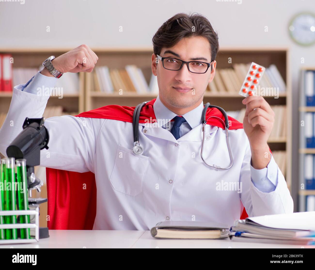 The superhero doctor working in the lab hospital Stock Photo - Alamy