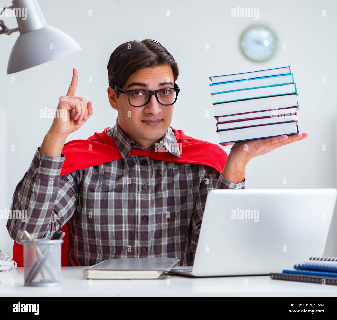 Super hero student books studying hi-res stock photography and images ...