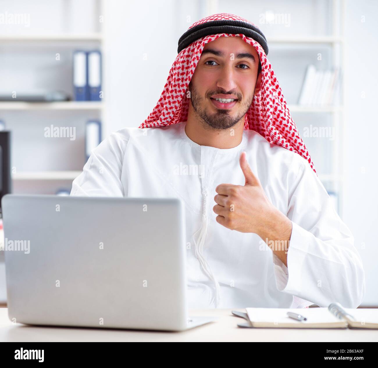 The arab businessman working in the office Stock Photo - Alamy