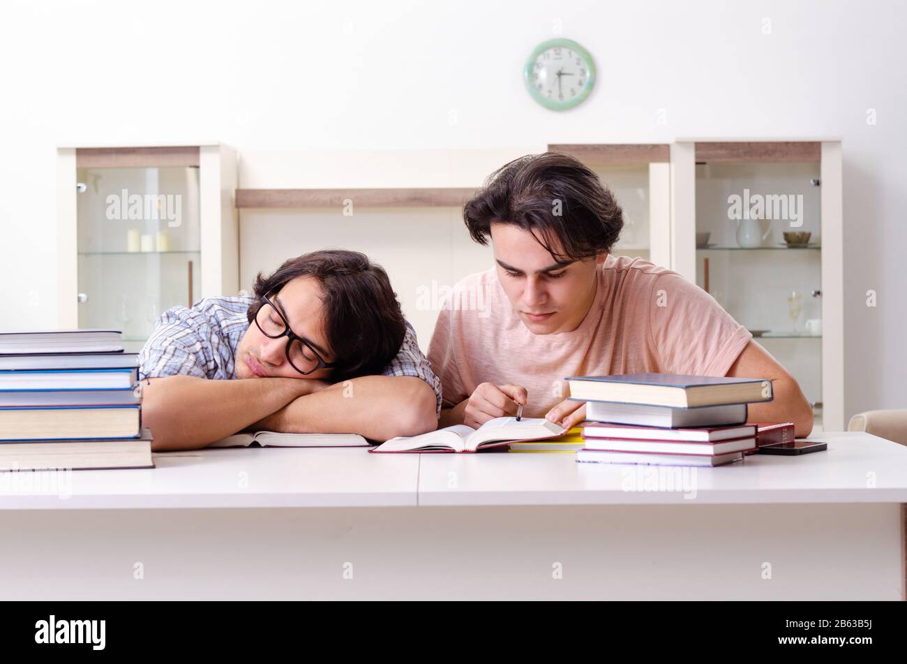 The two male students preparing for exams at home Stock Photo - Alamy
