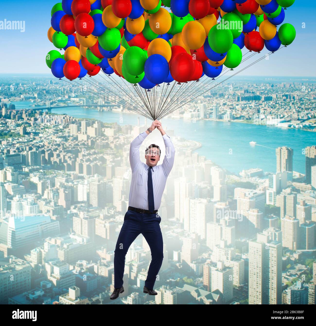 The businessman flying on balloons in challenge concept Stock Photo - Alamy