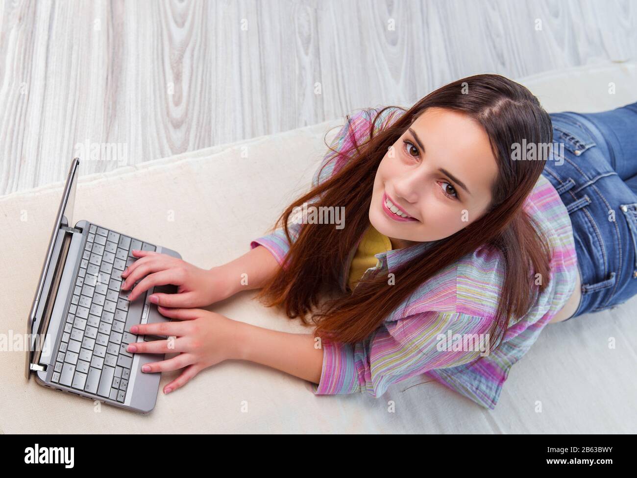 The young girl surfing internet on laptop Stock Photo - Alamy