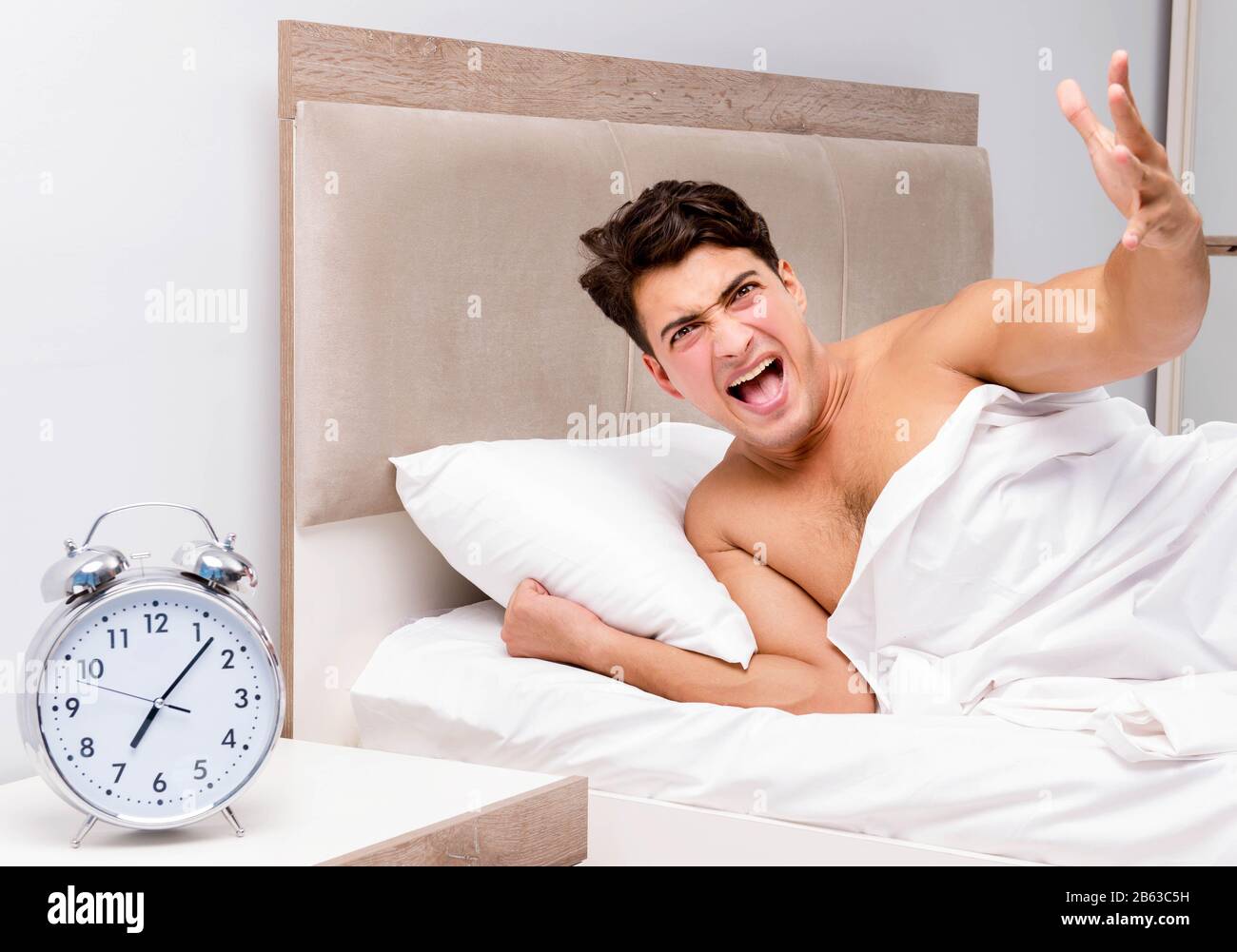The man having trouble waking up in morning Stock Photo - Alamy