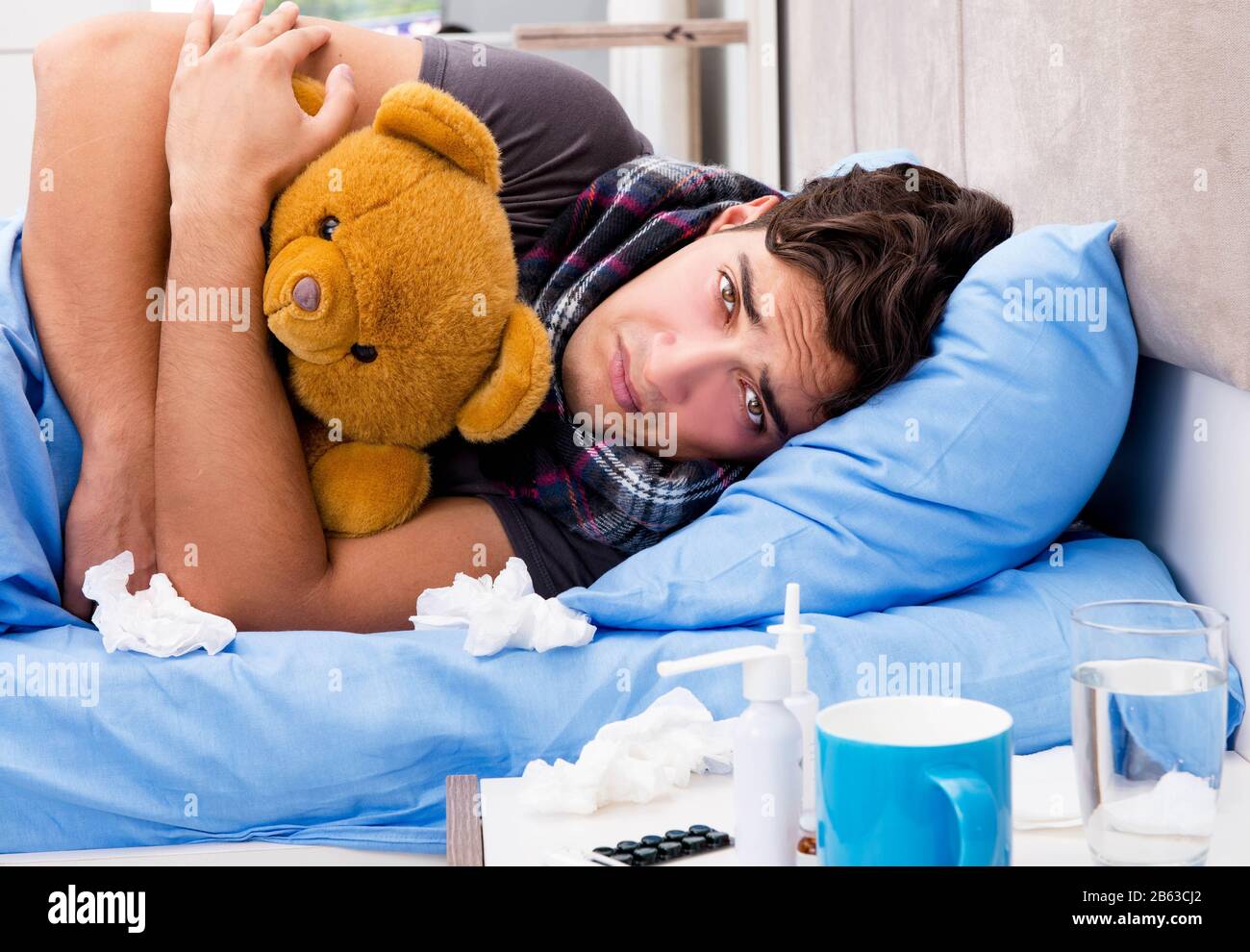 The sick ill man in the bed taking medicines and drugs Stock Photo - Alamy