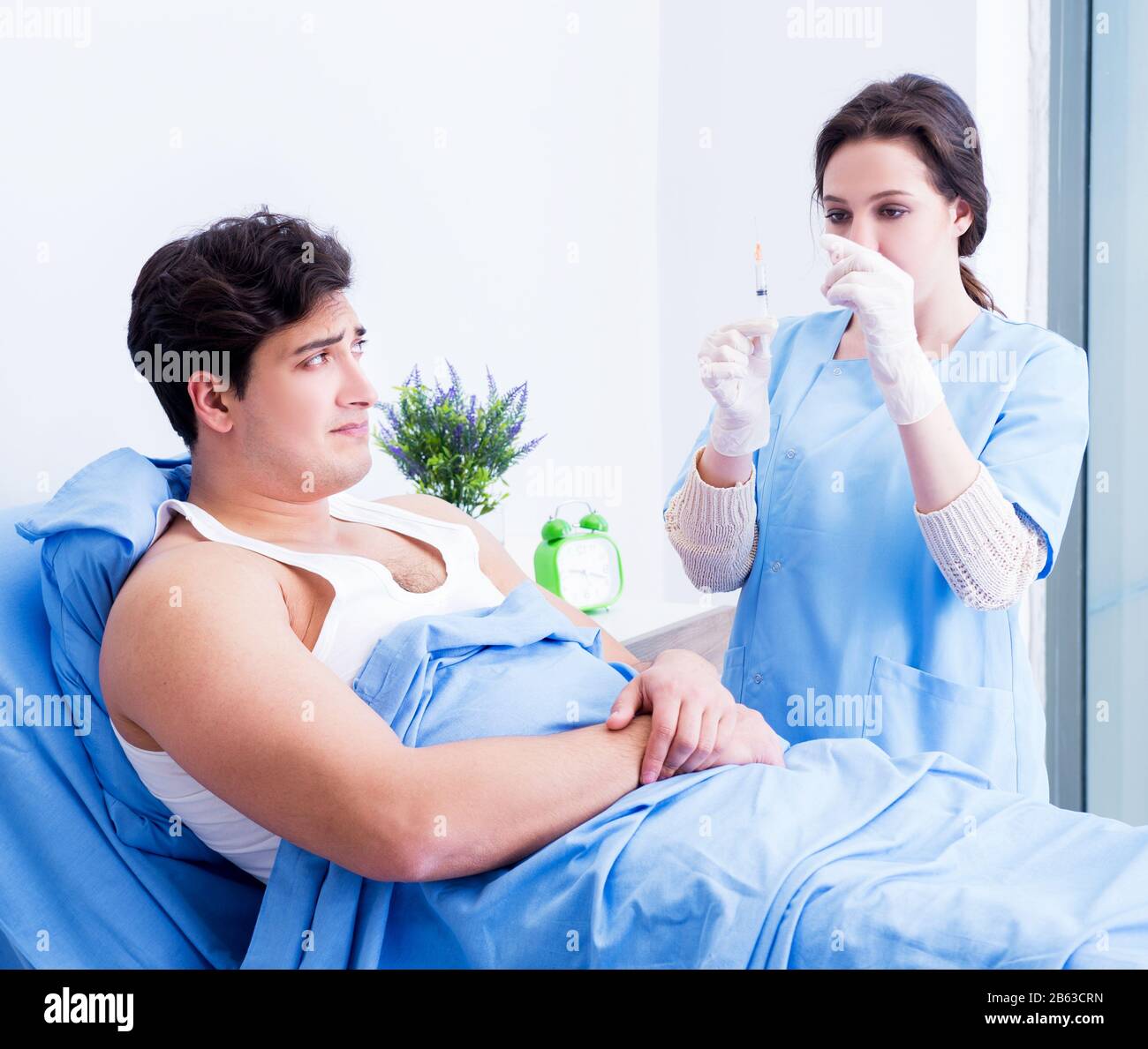 The doctor doing medical injection in hospital room Stock Photo - Alamy