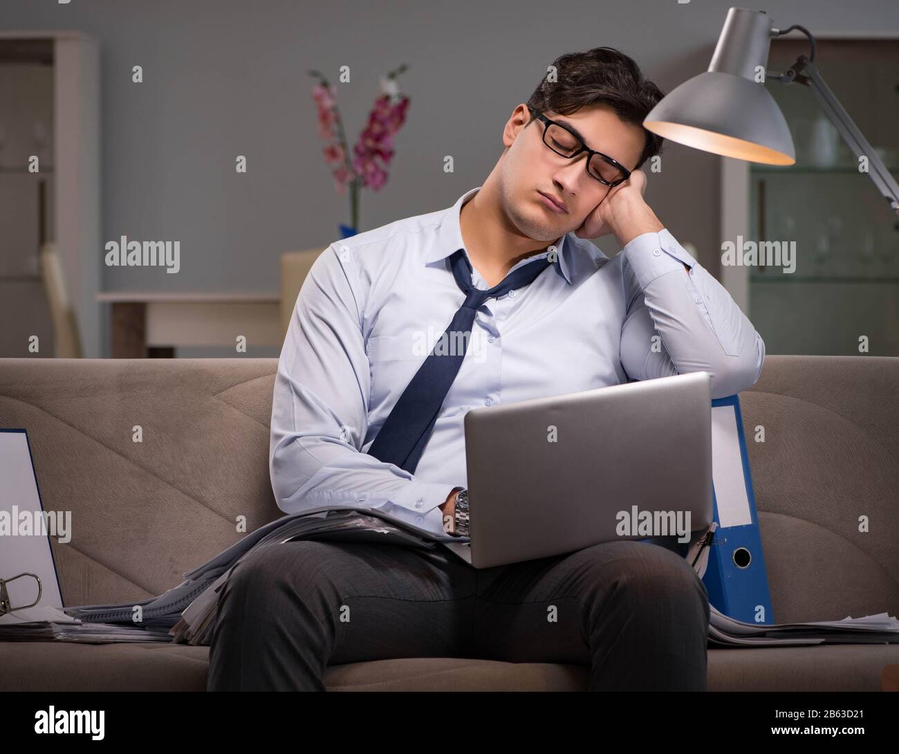 The businessman workaholic working late at home Stock Photo - Alamy