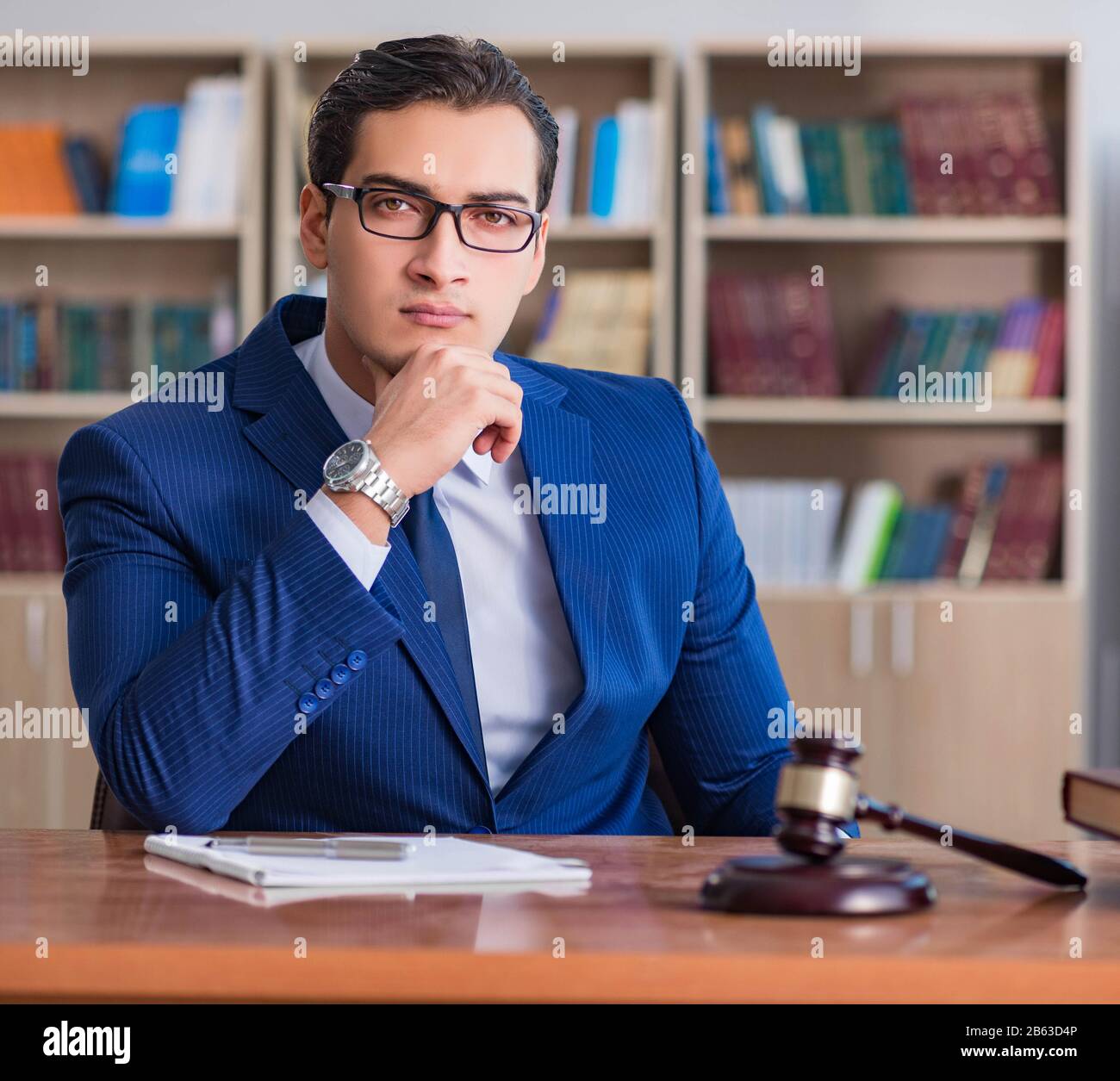 The handsome judge with gavel sitting in courtroom Stock Photo - Alamy