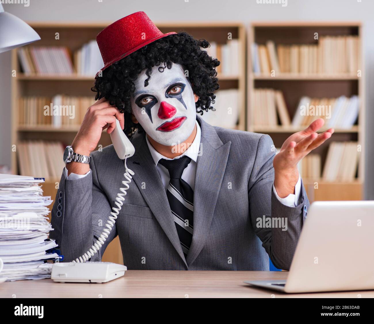 The clown businessman working in the office Stock Photo - Alamy