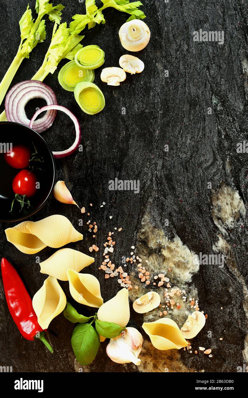 Multiple vegetable on black marble top Stock Photo - Alamy