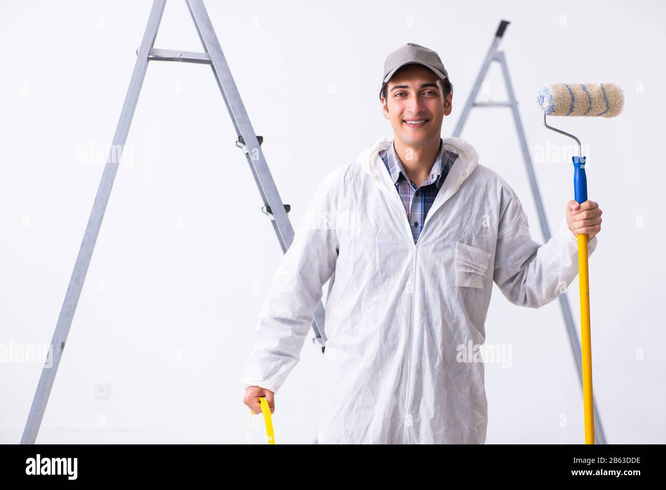 Painter working at the construction site Stock Photo - Alamy