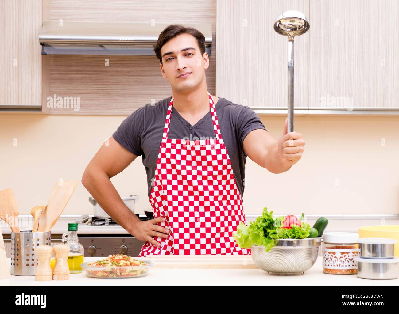 The man male cook preparing food in kitchen Stock Photo - Alamy