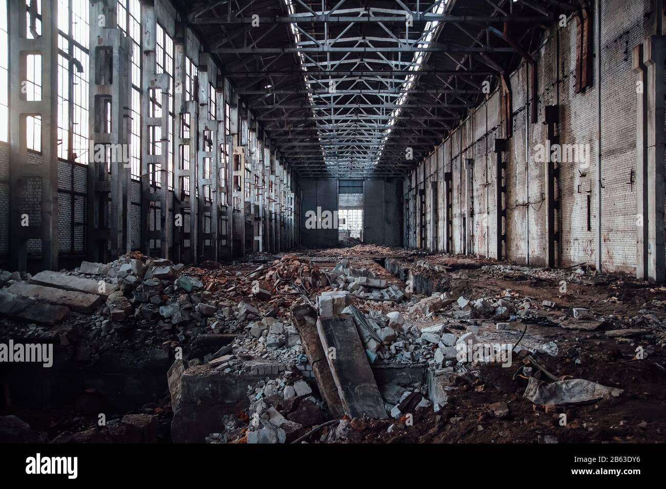 Abandoned large industrial hall with garbage waiting for demolition ...