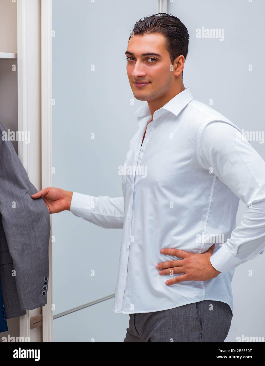 The businessman dressing up for work Stock Photo - Alamy