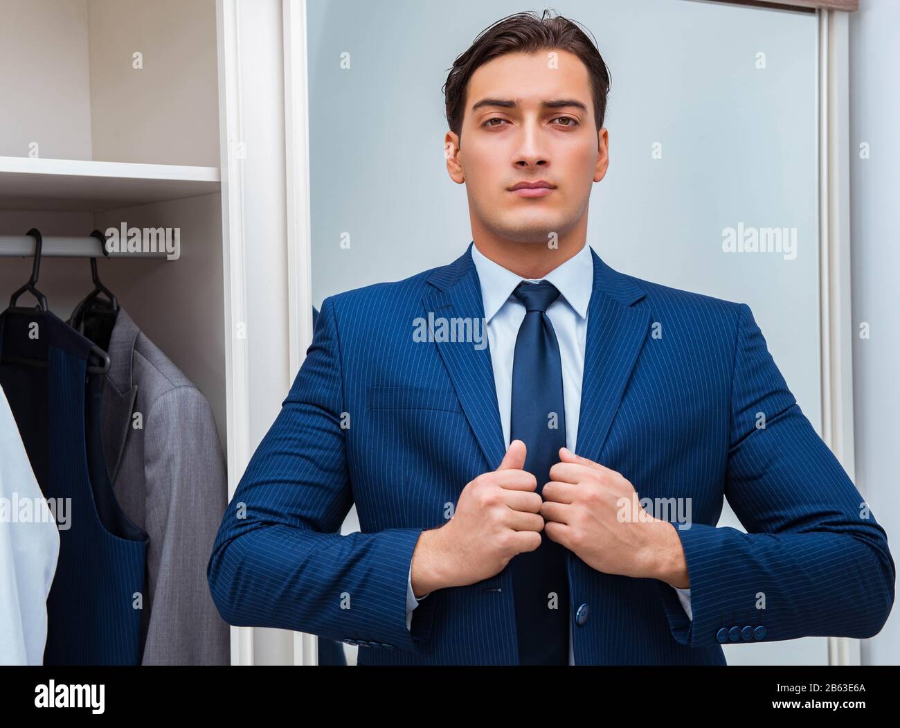 The businessman dressing up for work Stock Photo - Alamy