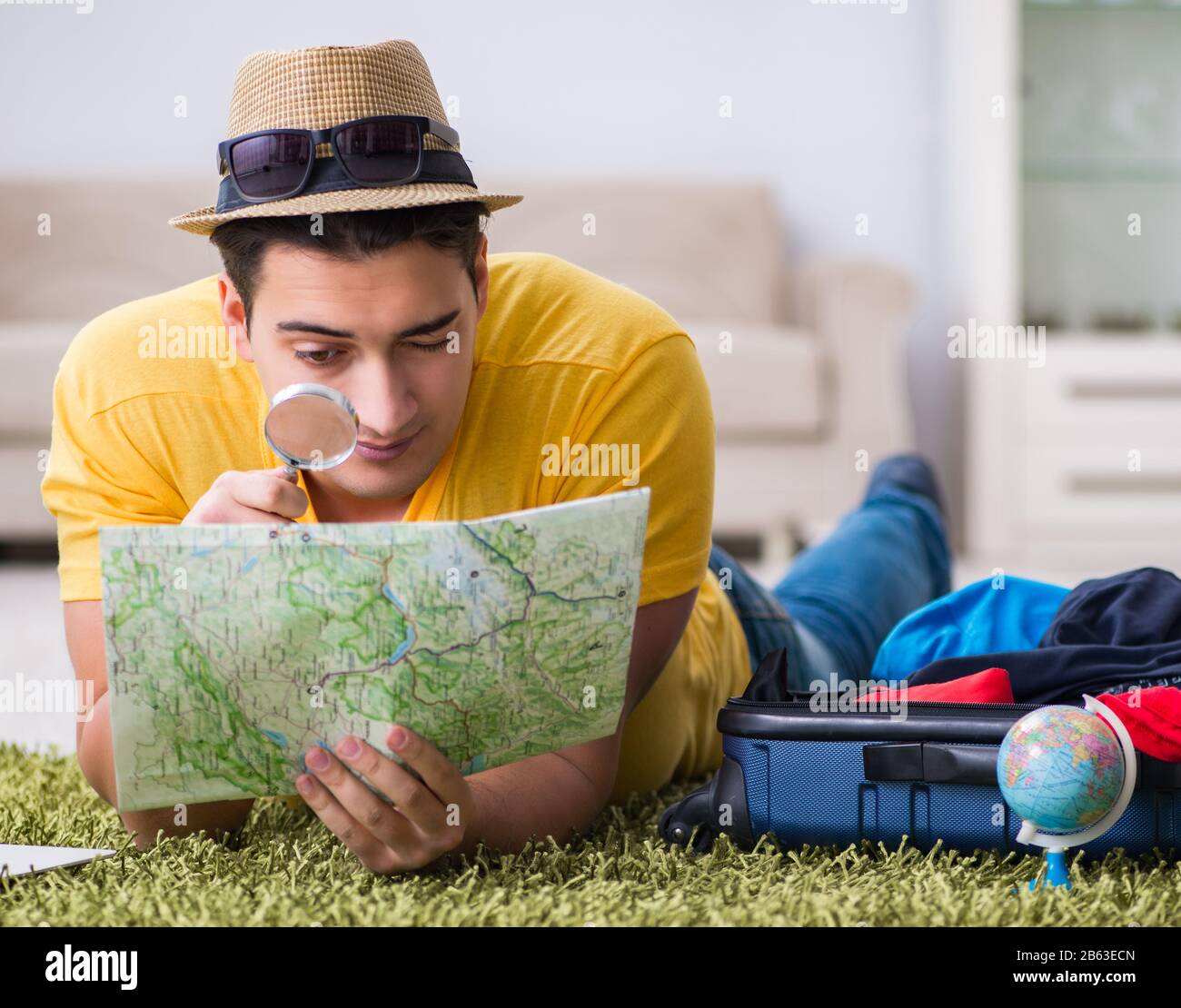 The man planning his vacation trip with map Stock Photo - Alamy