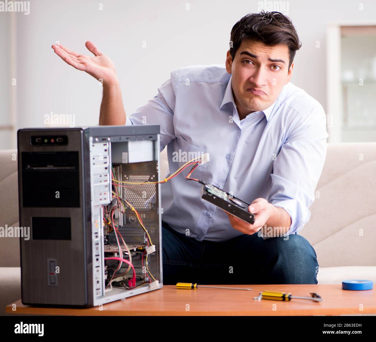 The frustrated man with broken pc computer Stock Photo - Alamy