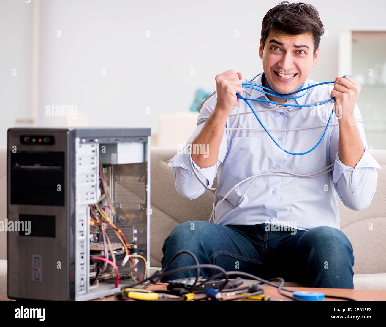 The frustrated man with broken pc computer Stock Photo - Alamy