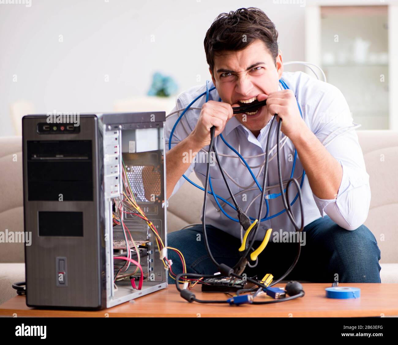 The frustrated man with broken pc computer Stock Photo - Alamy
