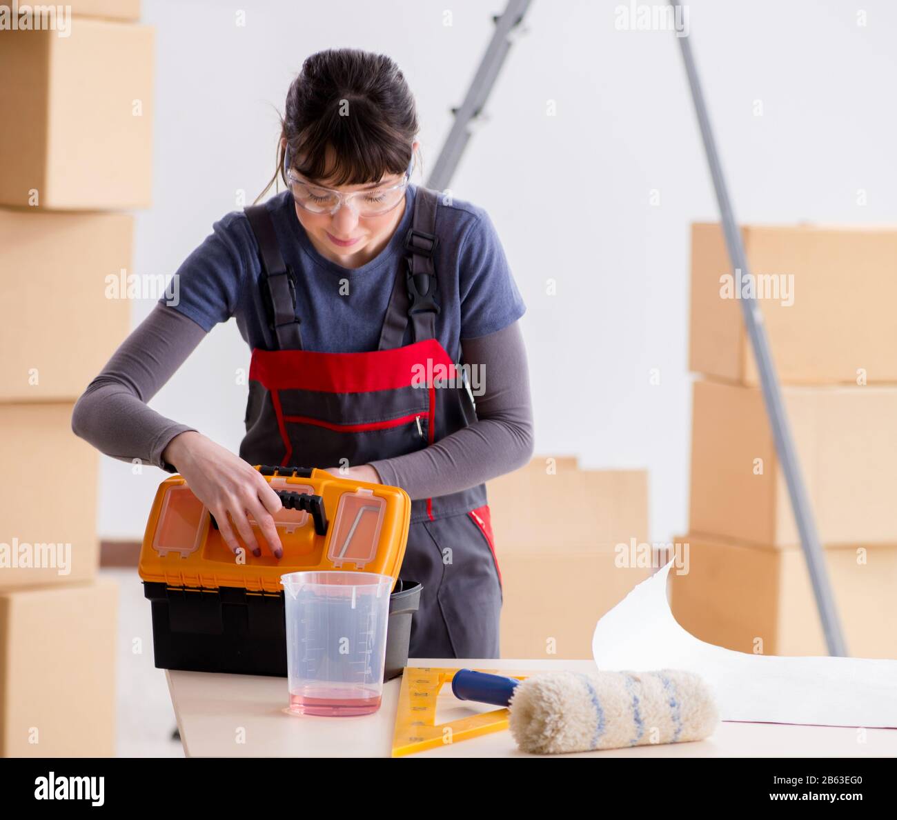 The woman preparing for wallpaper work Stock Photo - Alamy