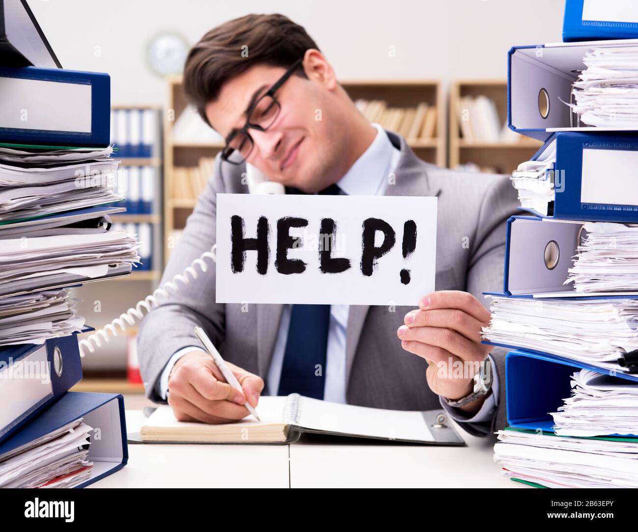 The busy businessman asking for help with work Stock Photo - Alamy