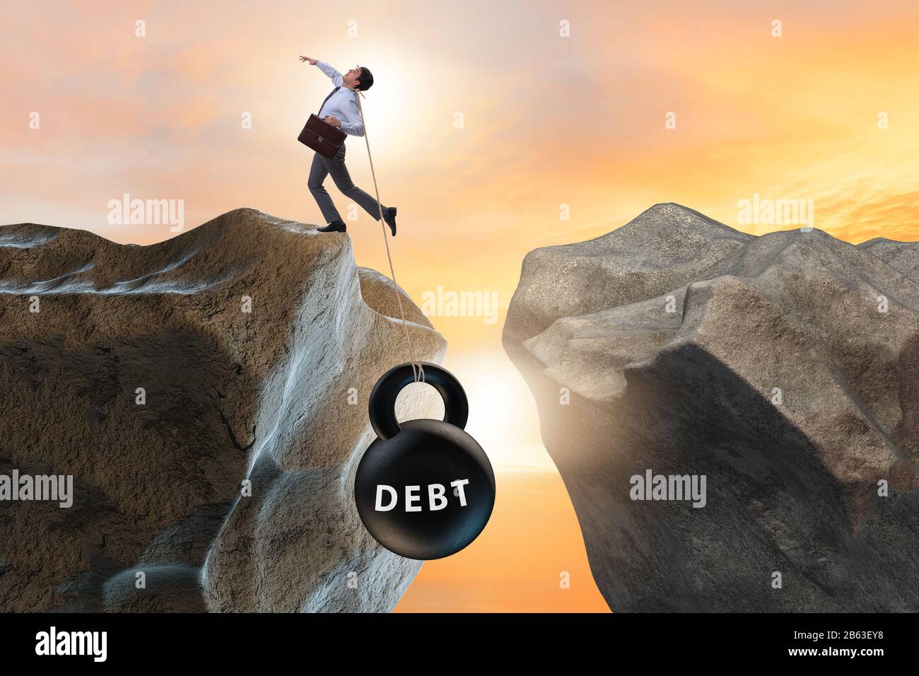 Concept of debt and load with businessman Stock Photo - Alamy
