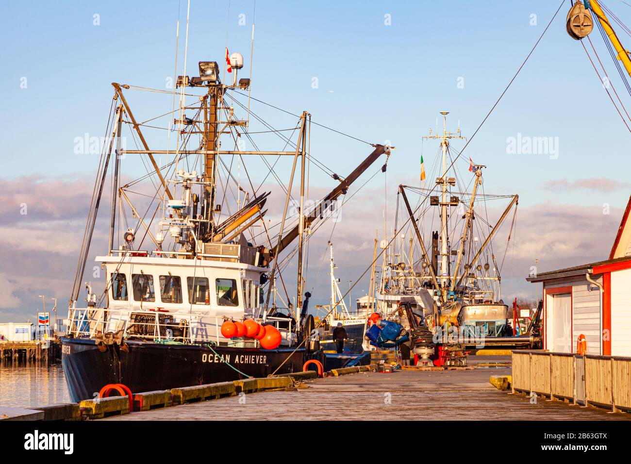Commercial fishing vessel unloading equipment at a dock in Steveston ...