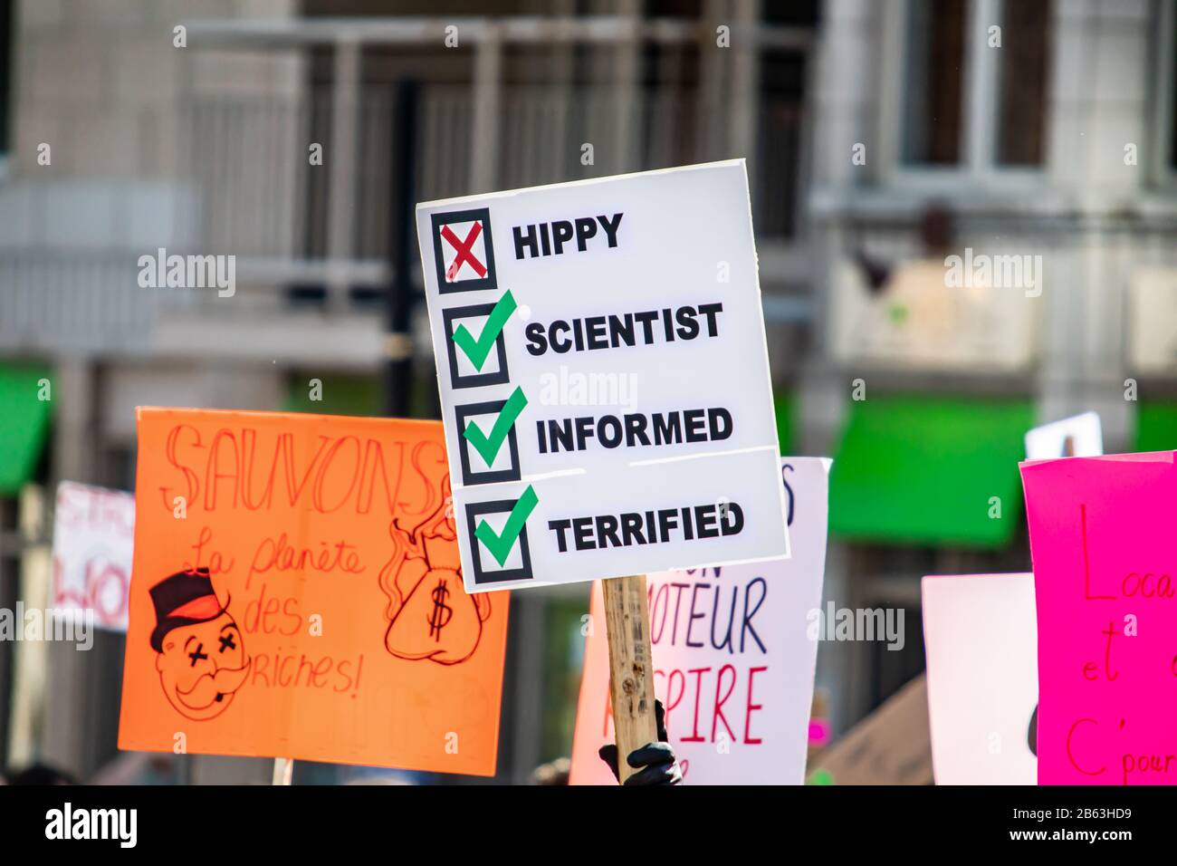 Not hippy, an informed and terrified scientist poster is seen during an ...