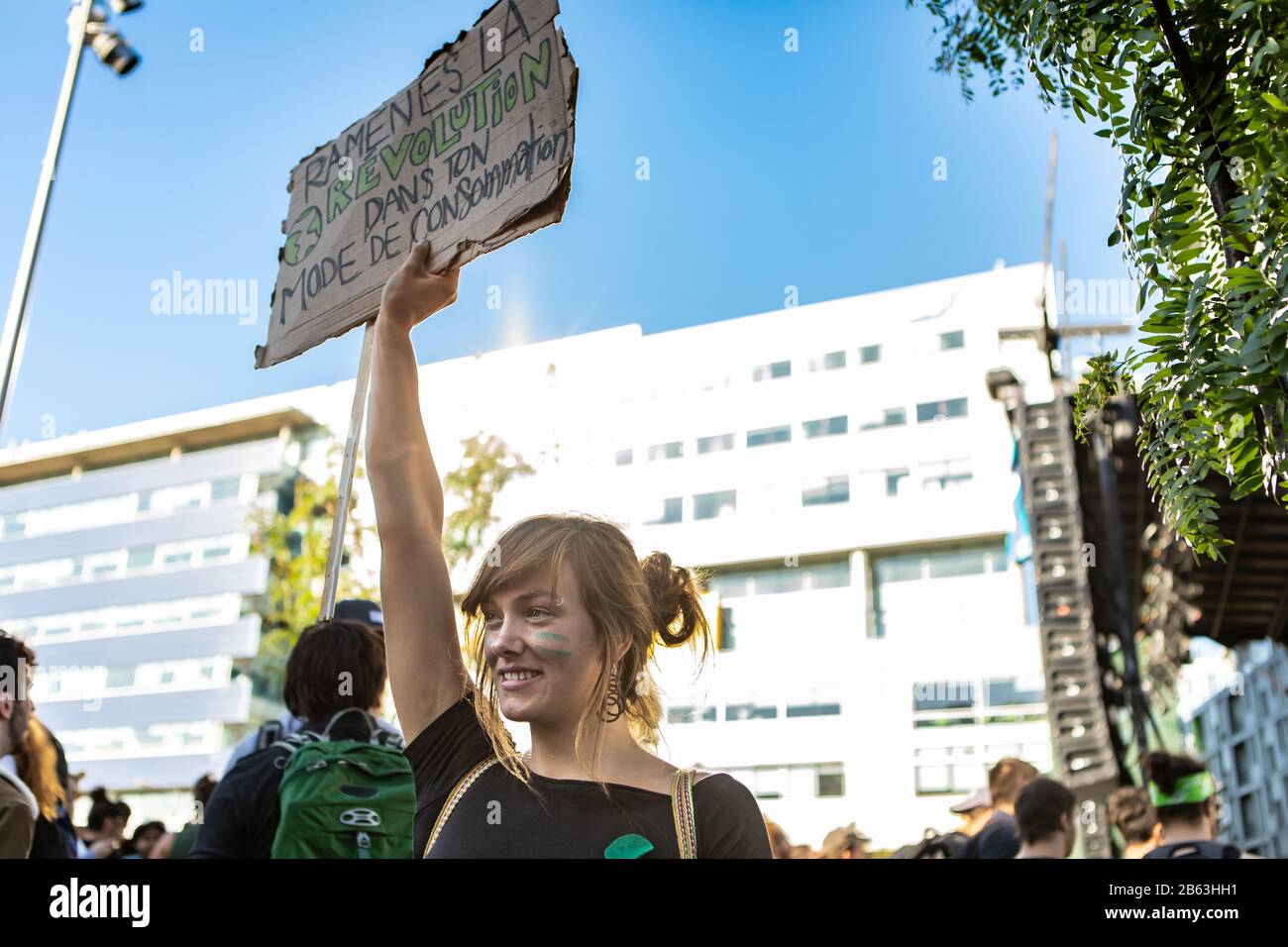 A low angle shot of a climate warrior girl, smiling during ...