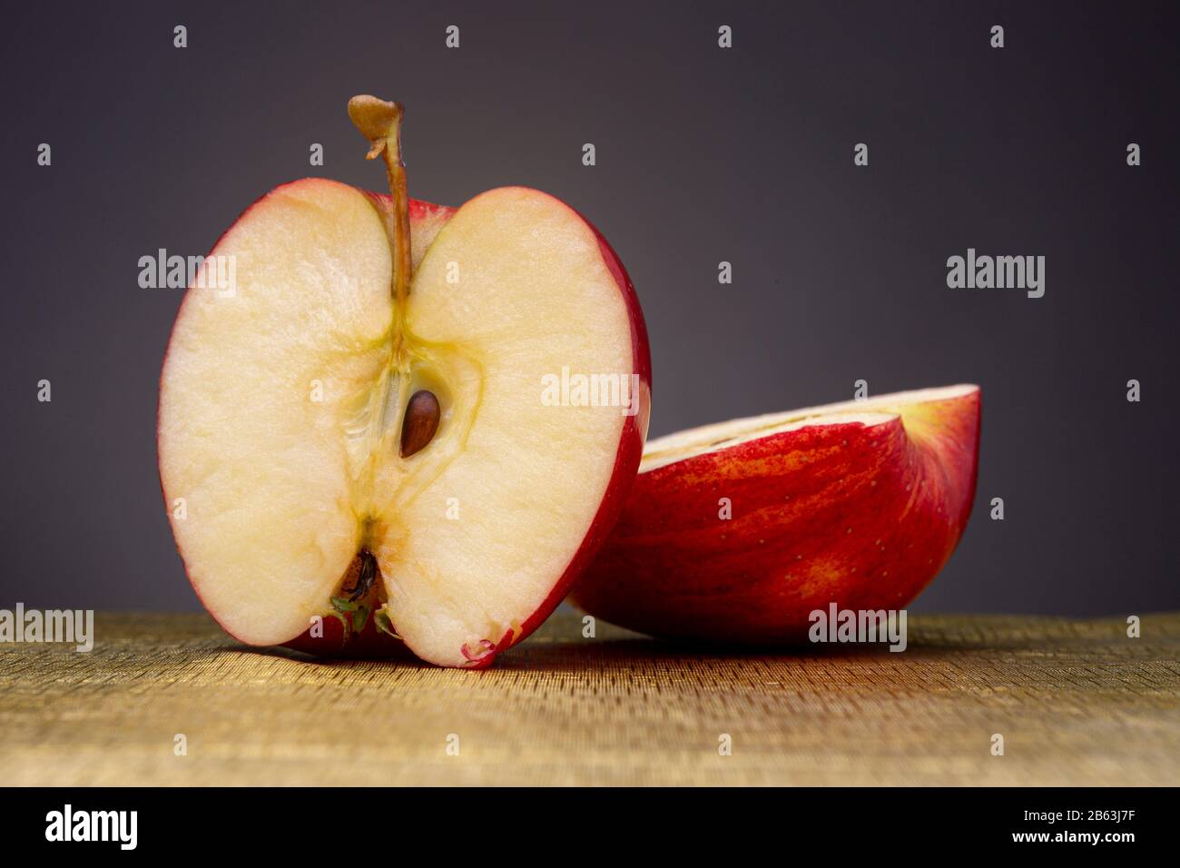 Vibrant bright red apple against dark studio background Stock Photo - Alamy