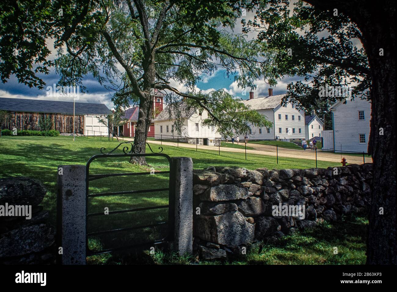 A colorful view of Canterbury Shaker Village on an overcast summer day ...