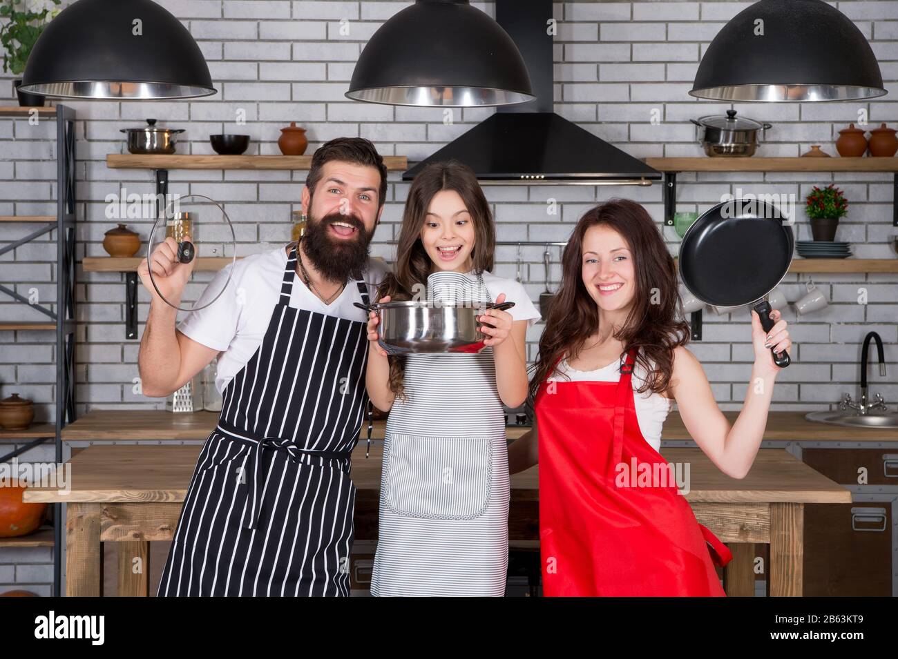 Cooking at home. Preparing food. kid chef cook dinner with parents ...