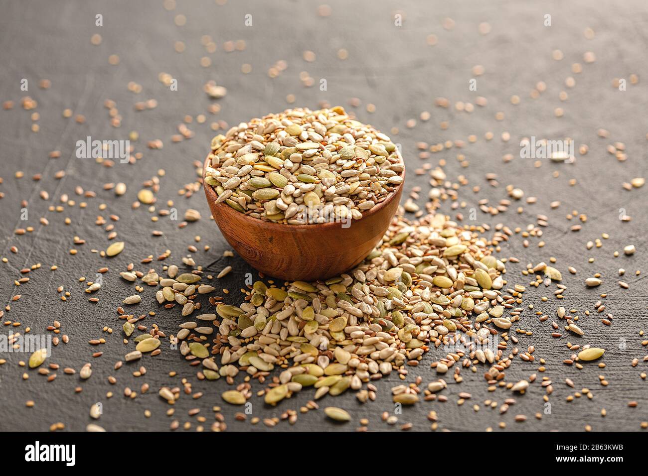 seed mix isolated on black concrete background Stock Photo - Alamy