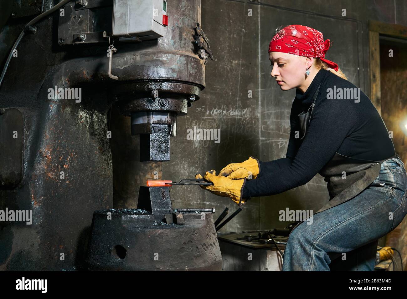 Woman blacksmith working in forge hi-res stock photography and images ...