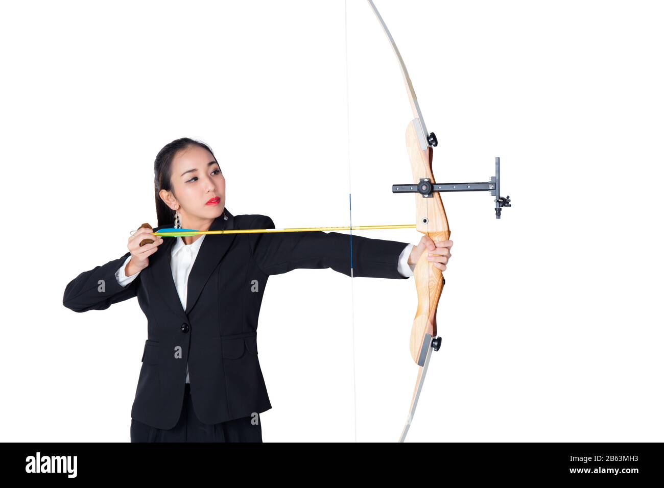 Portrait of concentrated female with crossbow in hands over white ...